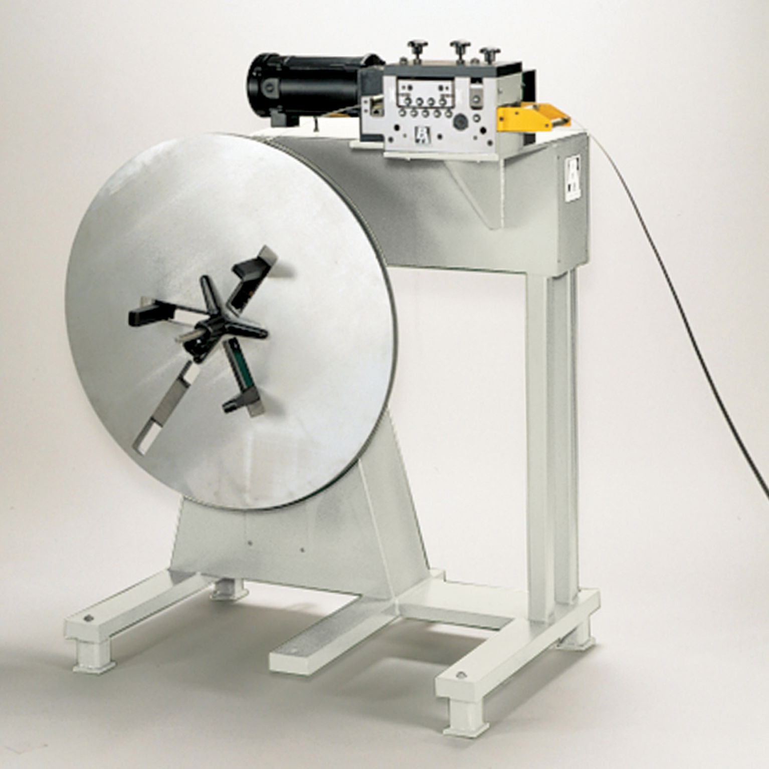 Light Duty Vertical Decoiler with Precision Straightener - Bruderer